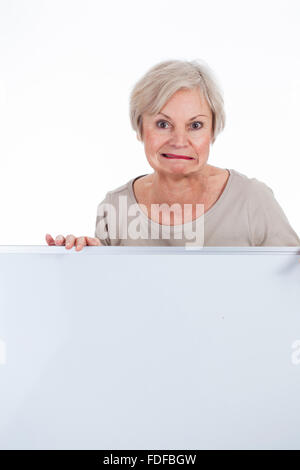 beautiful happy smiling older senior women holding sign with text space ...