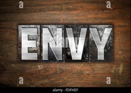 The word "Envy" written in vintage metal letterpress type isolated on a ...