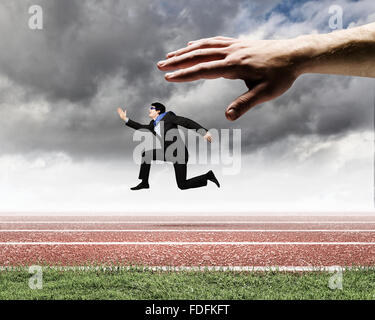 Big human hand catching businessman. Professional relations Stock Photo ...