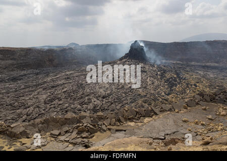 A steaming Hornito lies at the center of a sunken crater inside the ...