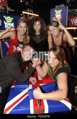 World arm wrestling champion Joanne "The Hitwoman" Poole shows reporter ...