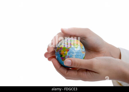 Child holding a small globe in hand on white background Stock Photo - Alamy