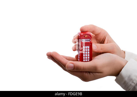 Telephone booth in hand on a white background Stock Photo - Alamy