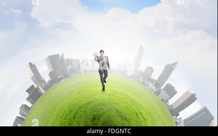 Young businessman running and tryinhg to catch up with something Stock ...