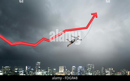 Businesswoman pulling arrow with rope and making it raise up Stock ...
