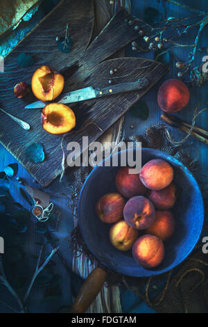 Peaches on an old rustic table Vertical Stock Photo - Alamy