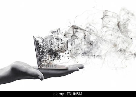 Human hand holding burning laptop on palm Stock Photo - Alamy
