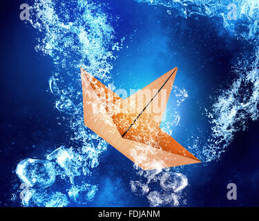 Paper ship sinking in clear blue water Stock Photo - Alamy