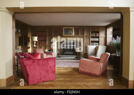 An inglenook fireplace in an English country cottage, decorated at ...