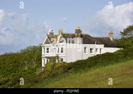 Broom Parc perched on the clifftop at Veryan, near Truro, Cornwall, a ...