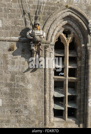 Parachute memorial on tower of church, Sainte-Mere-Eglise, Normandy ...