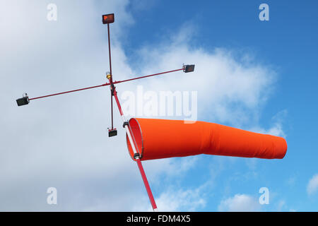 Illuminated windsock blowing in strong winds the lights allow night ...