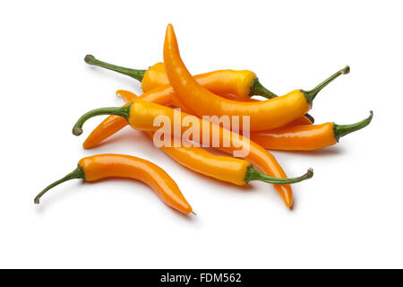 Whole and cut orange hot chili peppers on white background, flat lay ...
