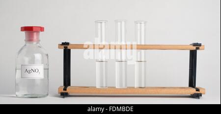 Three test tubes on rack and AgNO3 in chemical bottle Stock Photo - Alamy