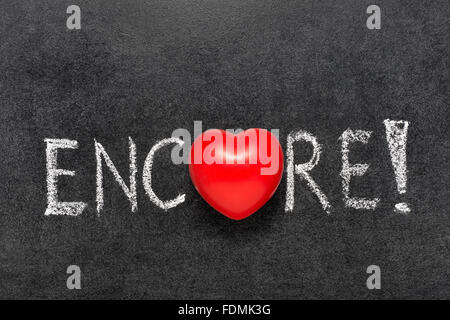 encore exclamation handwritten on blackboard with heart symbol instead ...
