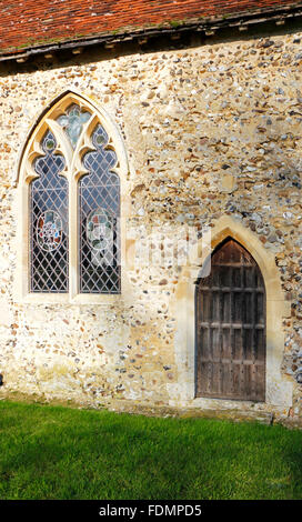 A view of the Priest's door and chancel window at the parish church of ...