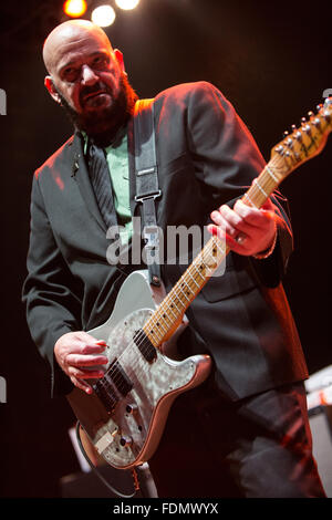 Singer singing rock. Sound producer recording song in a music studio ...