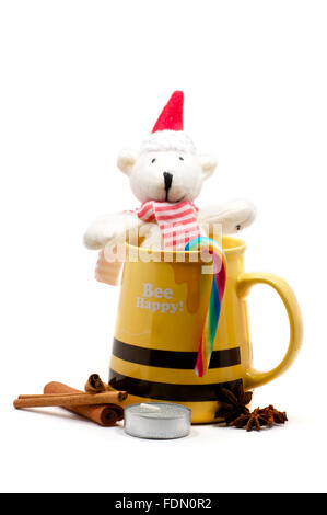 Close-up, candle and cinnamon sticks on the background of a gray ...