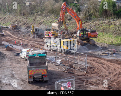 Construction of a new road layout with a digger and coned off area of ...