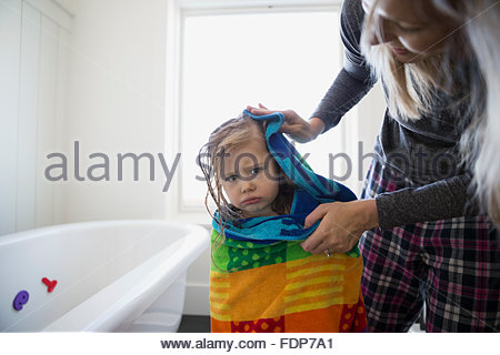Woman drying off with towel Stock Photo - Alamy