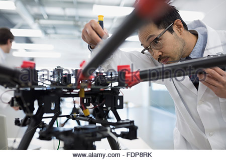 Men working at assembling line in Hyundai car chassis factory in Seoul ...