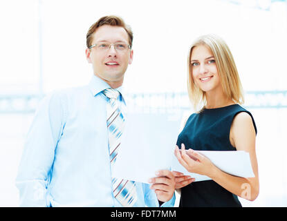 Two young business collegue working together in office Stock Photo - Alamy