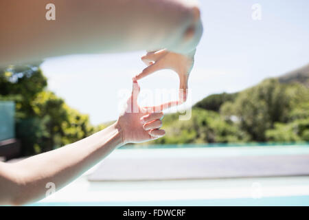 Woman making square with hands Stock Photo - Alamy
