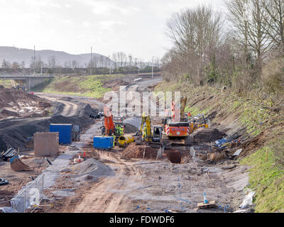 Construction of a new road layout with a digger and coned off area of ...