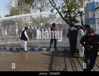 Security forces use a water cannon to disperse supporters of ...