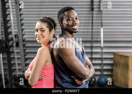 Fit couple back to back Stock Photo - Alamy
