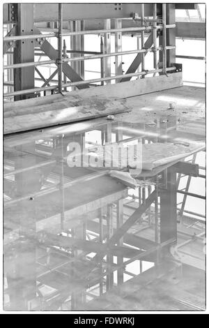 A construction site with concrete slab with water puddle and ...