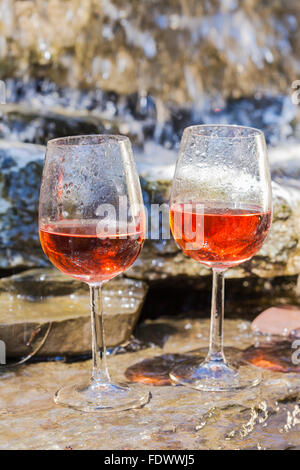 wine cooled in waterfall during hiking break Stock Photo - Alamy