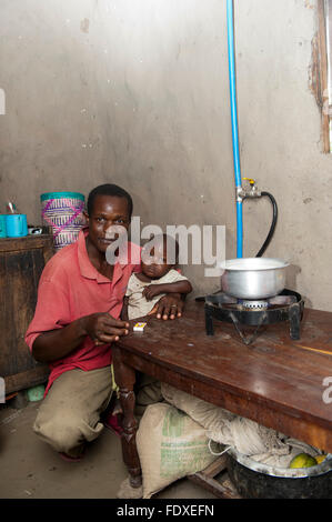 Cooking over a stove powered with methane gas from stored cattle manure ...