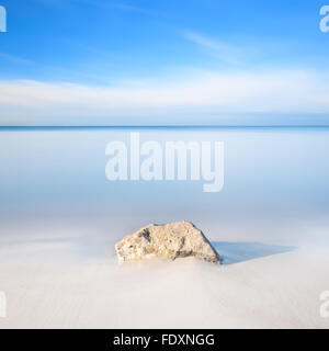 Beach, rock on sand Stock Photo - Alamy