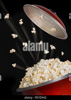 Popcorn exploding from bucket Stock Photo - Alamy