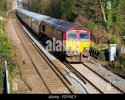 EWS class 66 diesel locomotive pulling two preserved railway carriages ...
