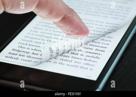 Reading an e-book on an iPhone 6 Plus smart phone Stock Photo - Alamy