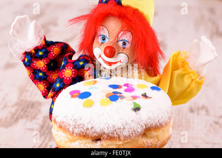 doughnut with clown at carnival Stock Photo - Alamy