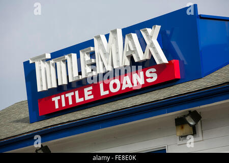 A logo sign outside of a TitleMax car title loan office in Tysons ...