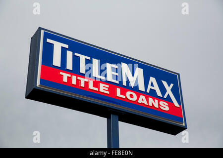 A logo sign outside of a TitleMax car title loan office in Tysons ...
