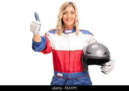 Cheerful female car racer holding a model car and pointing isolated on ...