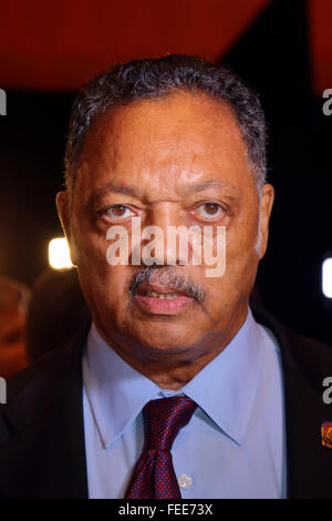 Democratic presidential candidate Jesse Jackson, left, watches his son ...