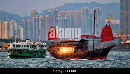 Traditional Chinese junk and tourist ferry, Victoria harbor, Hong Kong ...