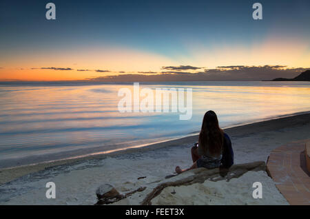 Woman on Matira Beach on the island of Bora Bora in French Polynesia ...
