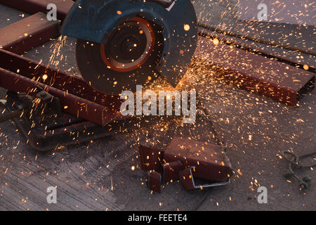 Cutting Steel channel (steel C chanel) with grinder. Sparks while ...