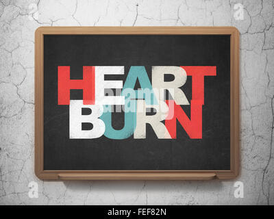 Medicine concept: Heartburn on School Board background Stock Photo - Alamy