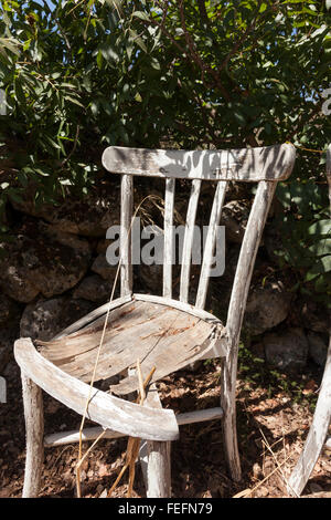 old damaged chair, worn, broken and dirty leather in different angles ...
