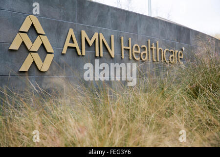 A logo sign outside of the headquarters of AMN Healthcare in San Diego ...