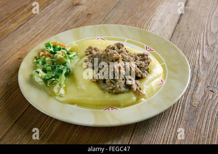 Botswana cuisine: seswaa beef stew with pap porridge and spinach close ...
