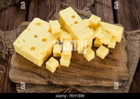 Diced Cheese (close-up shot) on rustic wooden background Stock Photo ...